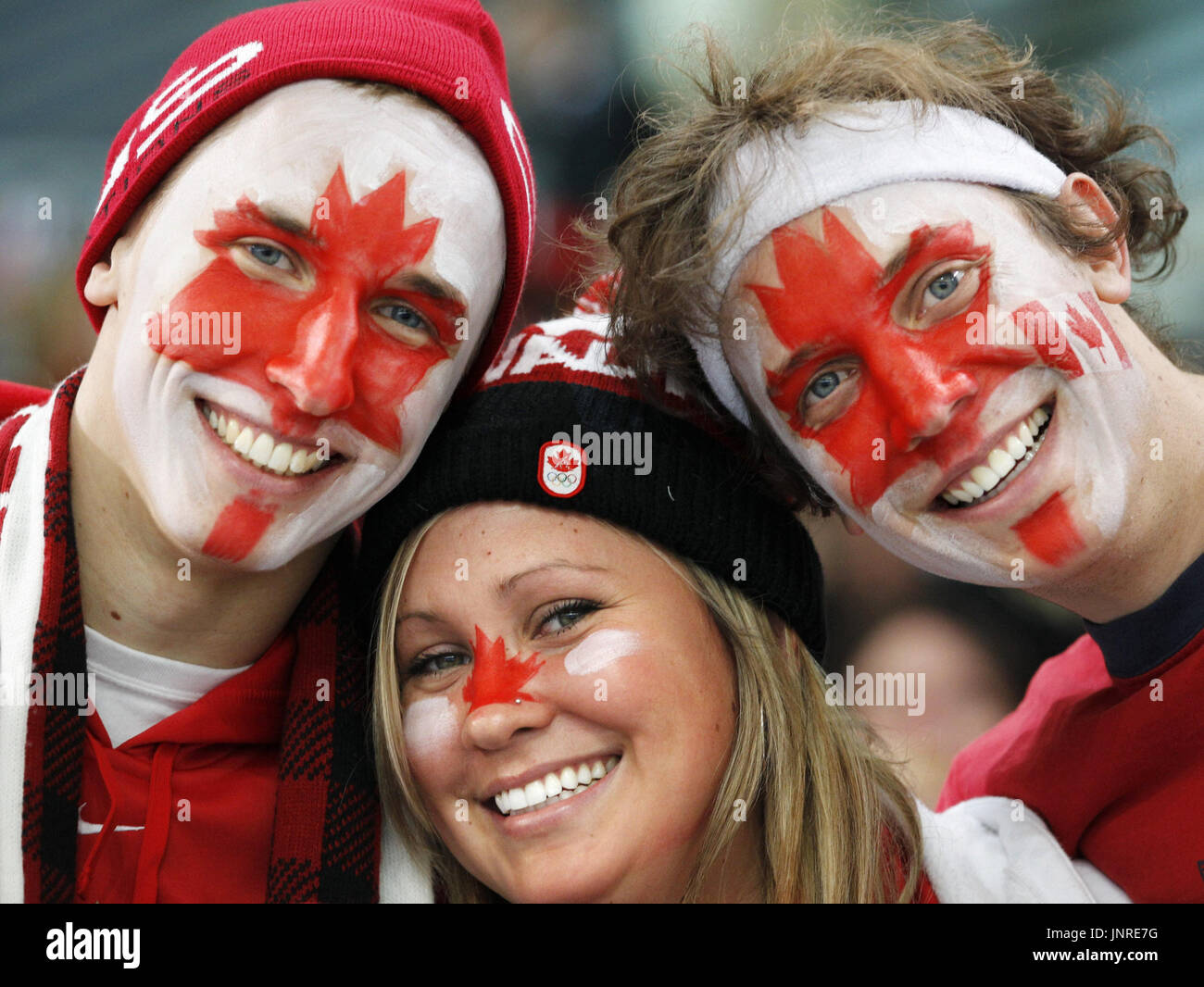 RICHMOND, Canada - People with paintings of the Canadian flag on their ...