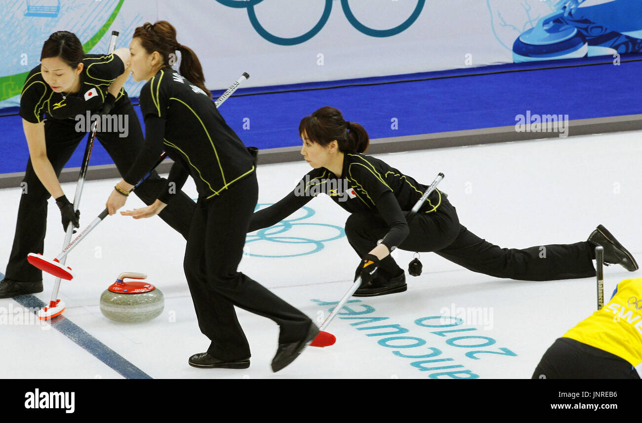 VANCOUVER, Canada - Kotomi Ishizaki (R) releases the stone as Anna ...