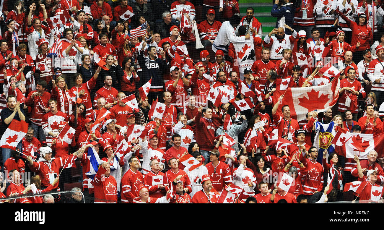 VANCOUVER, Canada - Spectators in red wave Canadian national flags ...