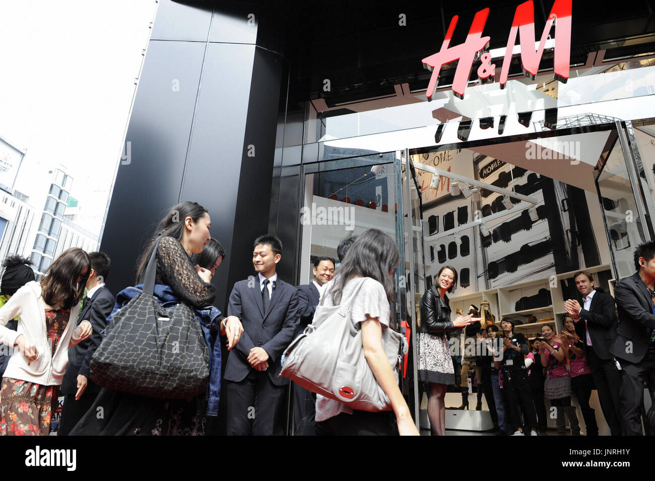 TOKYO, Japan - Shoppers enter a flagship store of Swedish fashion chain ...