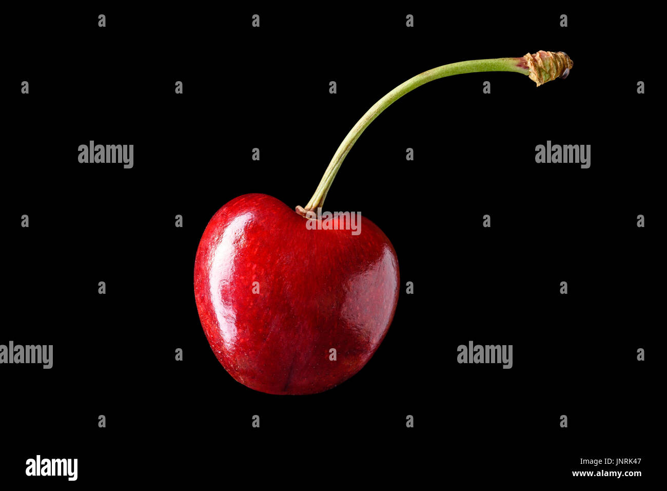 Isolated ripe sweet merry cherry over black background Stock Photo - Alamy