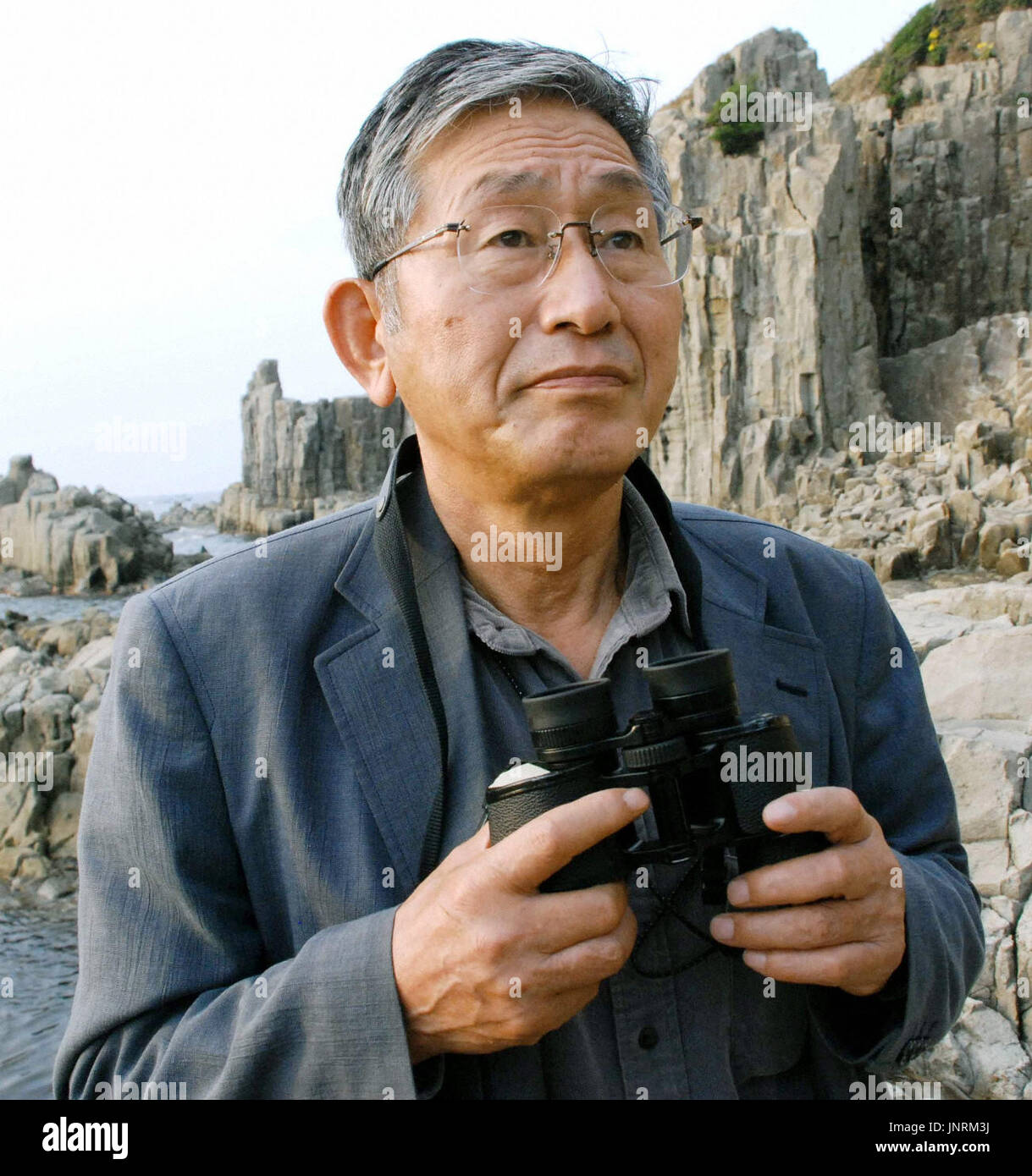 FUKUI, Japan - Former senior police officer Yukio Shige, carrying ...
