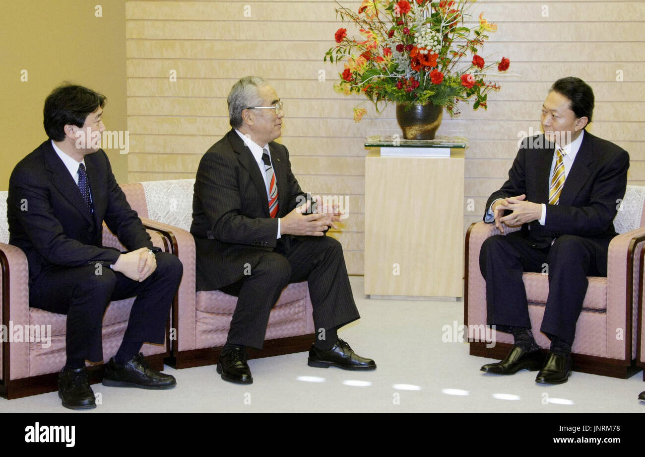 TOKYO, Japan - Prime Minister Yukio Hatoyama (R) talks with Tadashi Kato (C), head of the Ainu ...