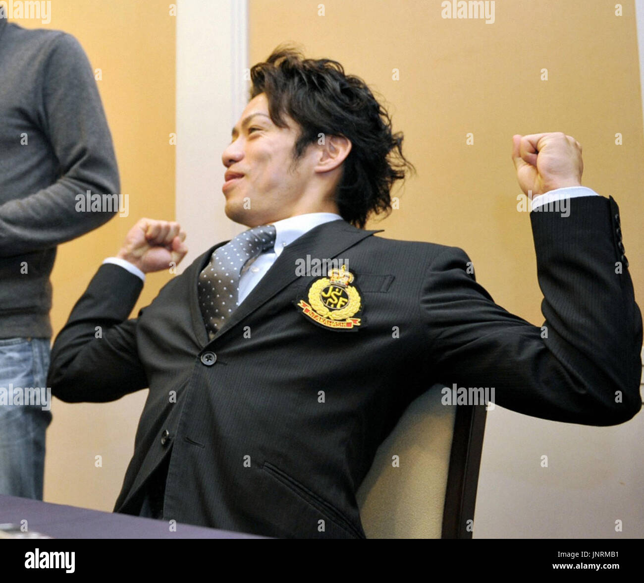 OSAKA, Japan - Japanese figure skater Daisuke Takahashi stretches after ...