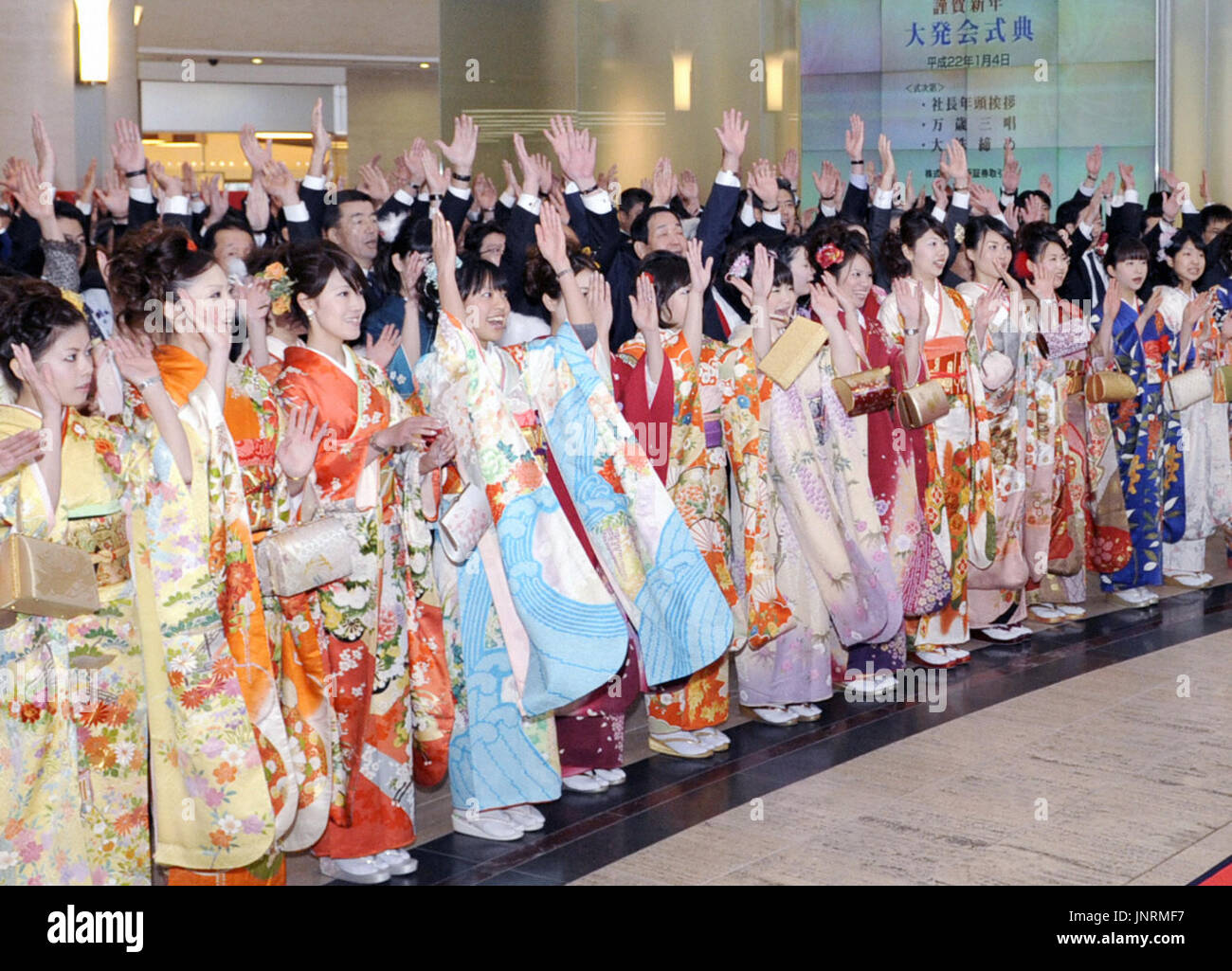 OSAKA, Japan - Women dressed in traditional kimono and others raise ...