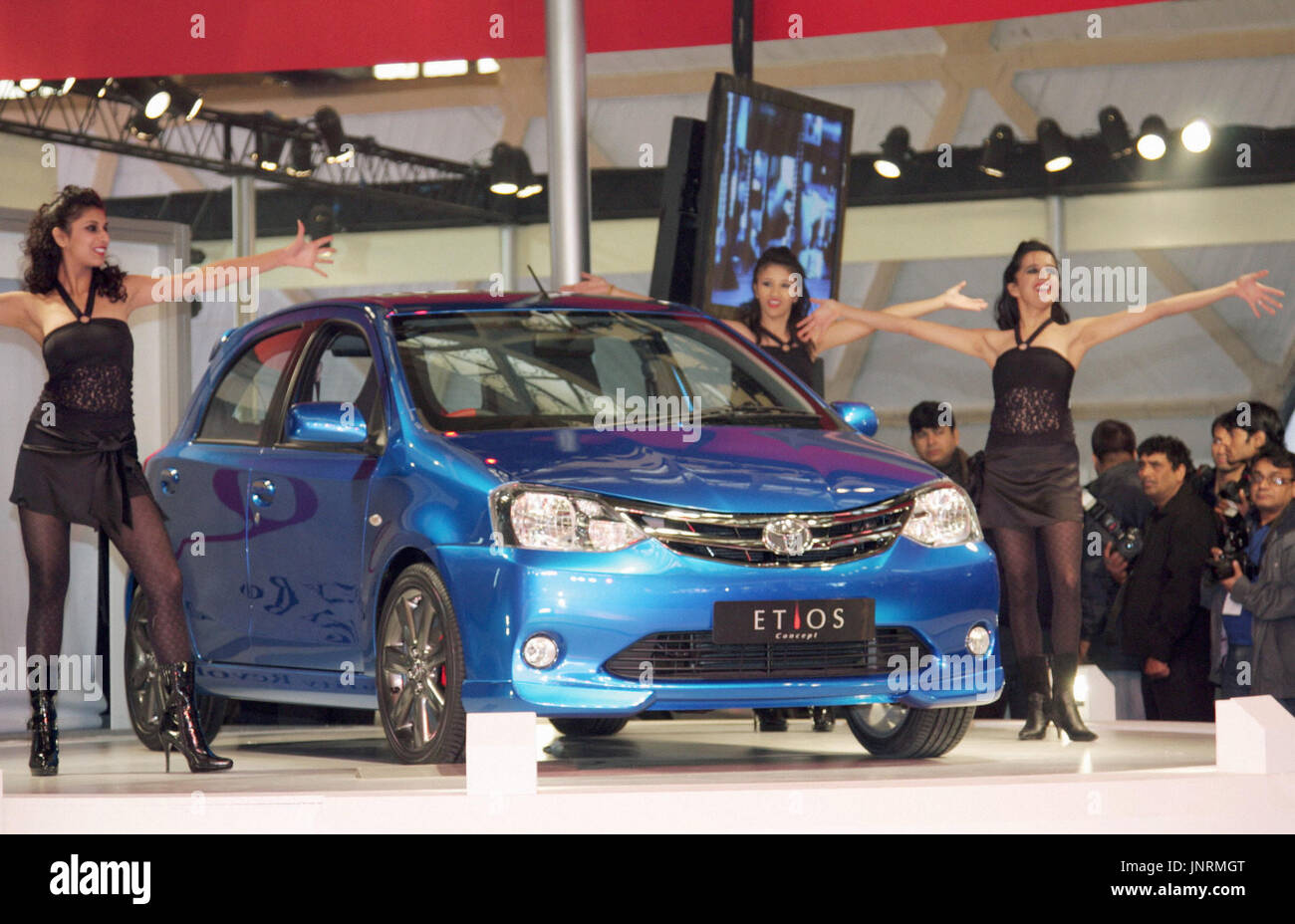 NEW DELHI, India - Models stand by Toyota Motor Corp.'s new Etios ...