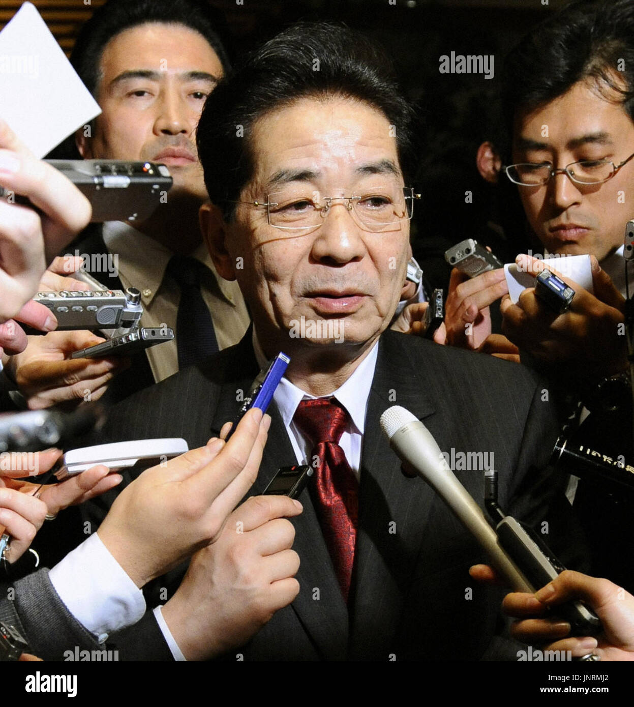 TOKYO, Japan - Yoshito Sengoku, administrative reform minister, speaks to reporters at the prime ...