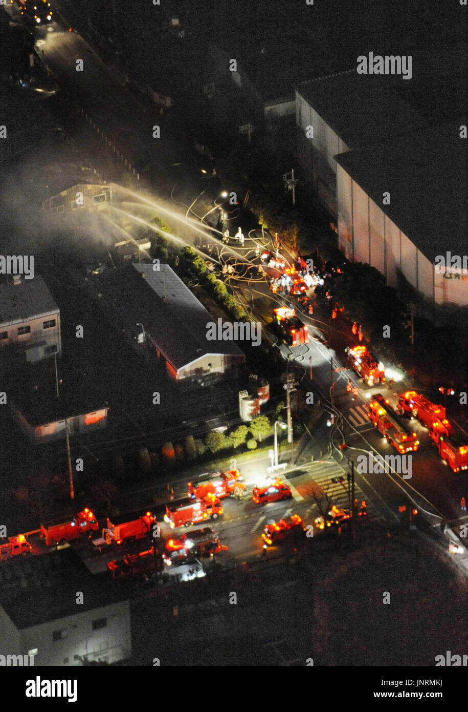 YOKOHAMA, Japan - Aerial photo taken Jan. 7, 2010, shows firefighters ...