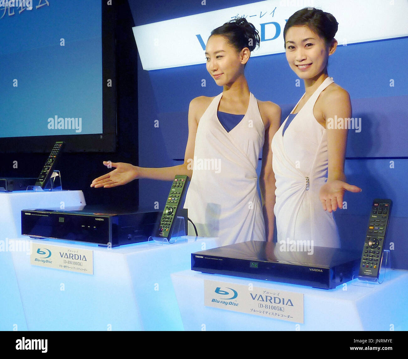 TOKYO, Japan - Two presenters show Toshiba Corp.'s models of Blu-ray ...