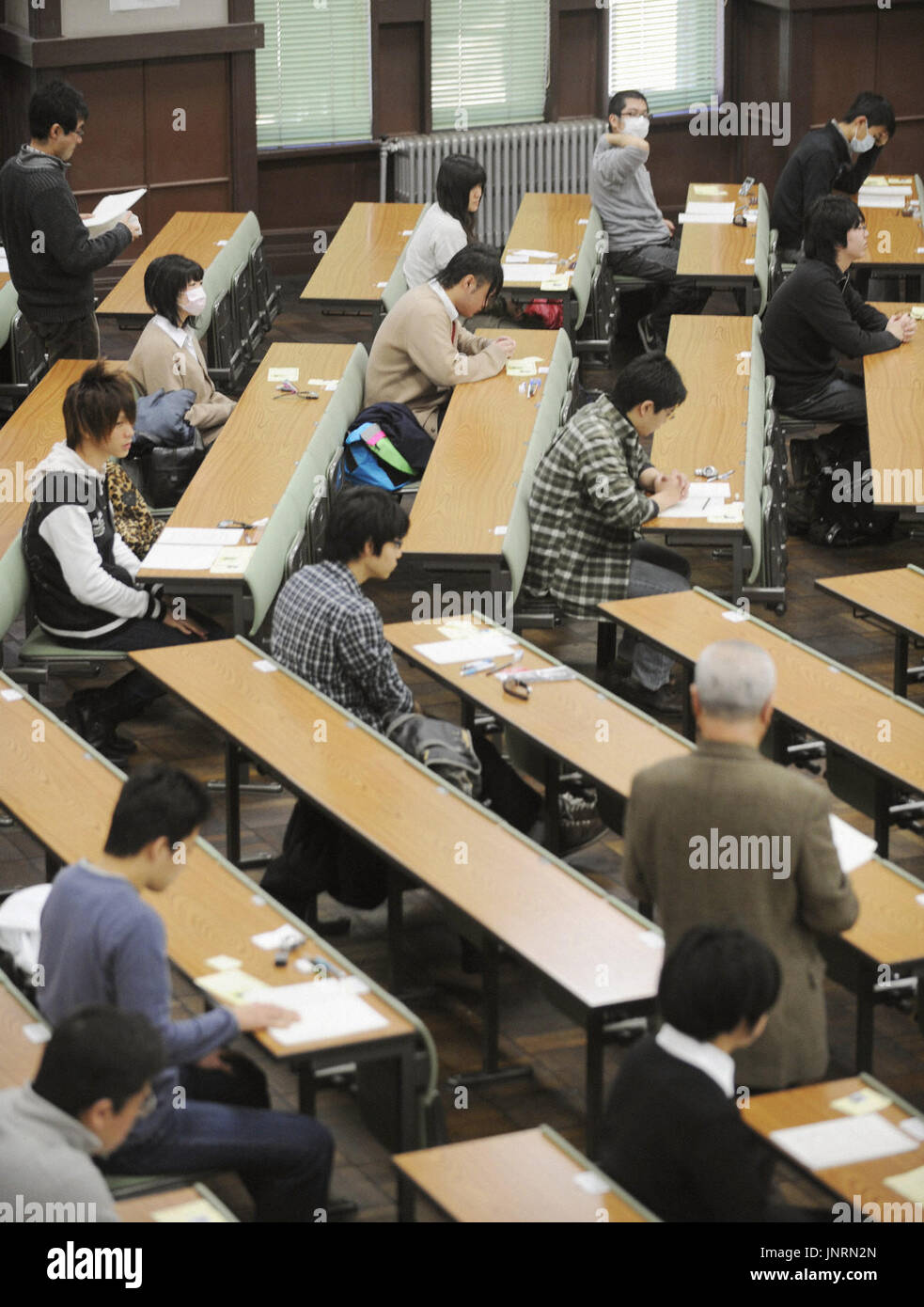 TOKYO, Japan - Applicants sit for the first day of unified college ...