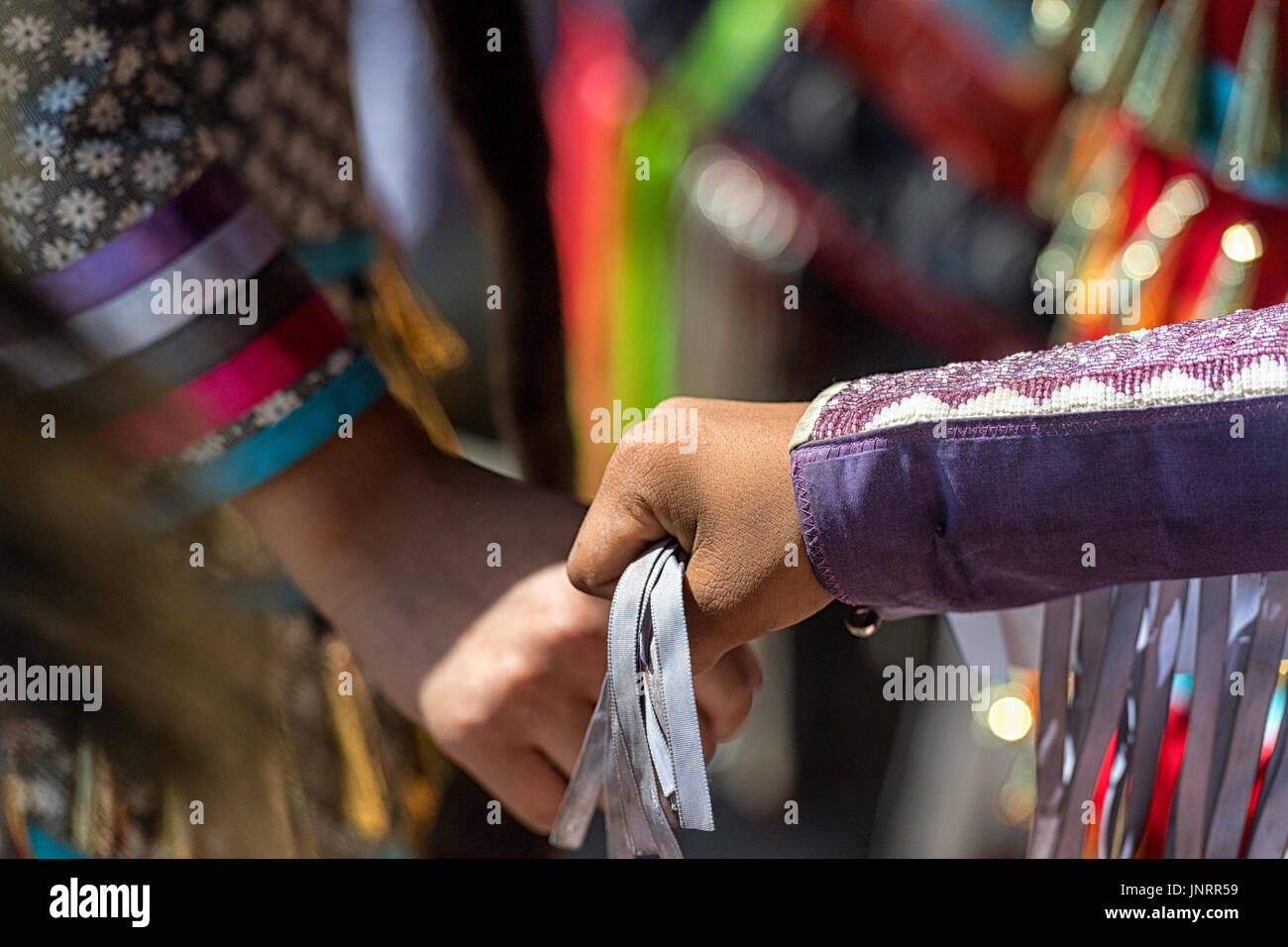 Native aboriginal dancers fist bump at the Tsuut'ina Nation Powwow in ...
