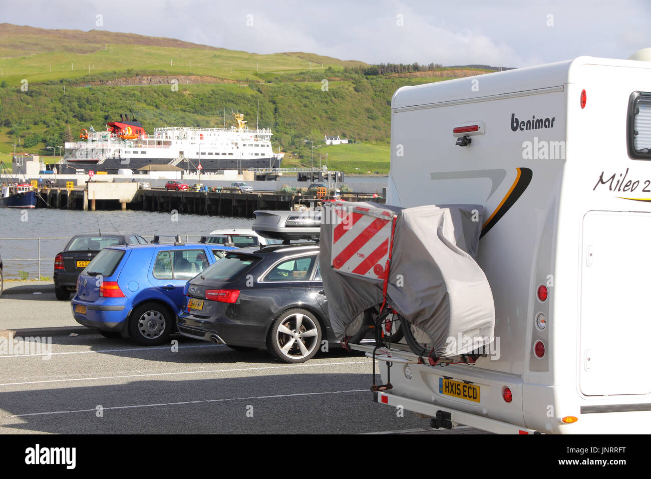 Vehicles queued at Uig Ferry terminal, waiting to board the Clamc ferry ...