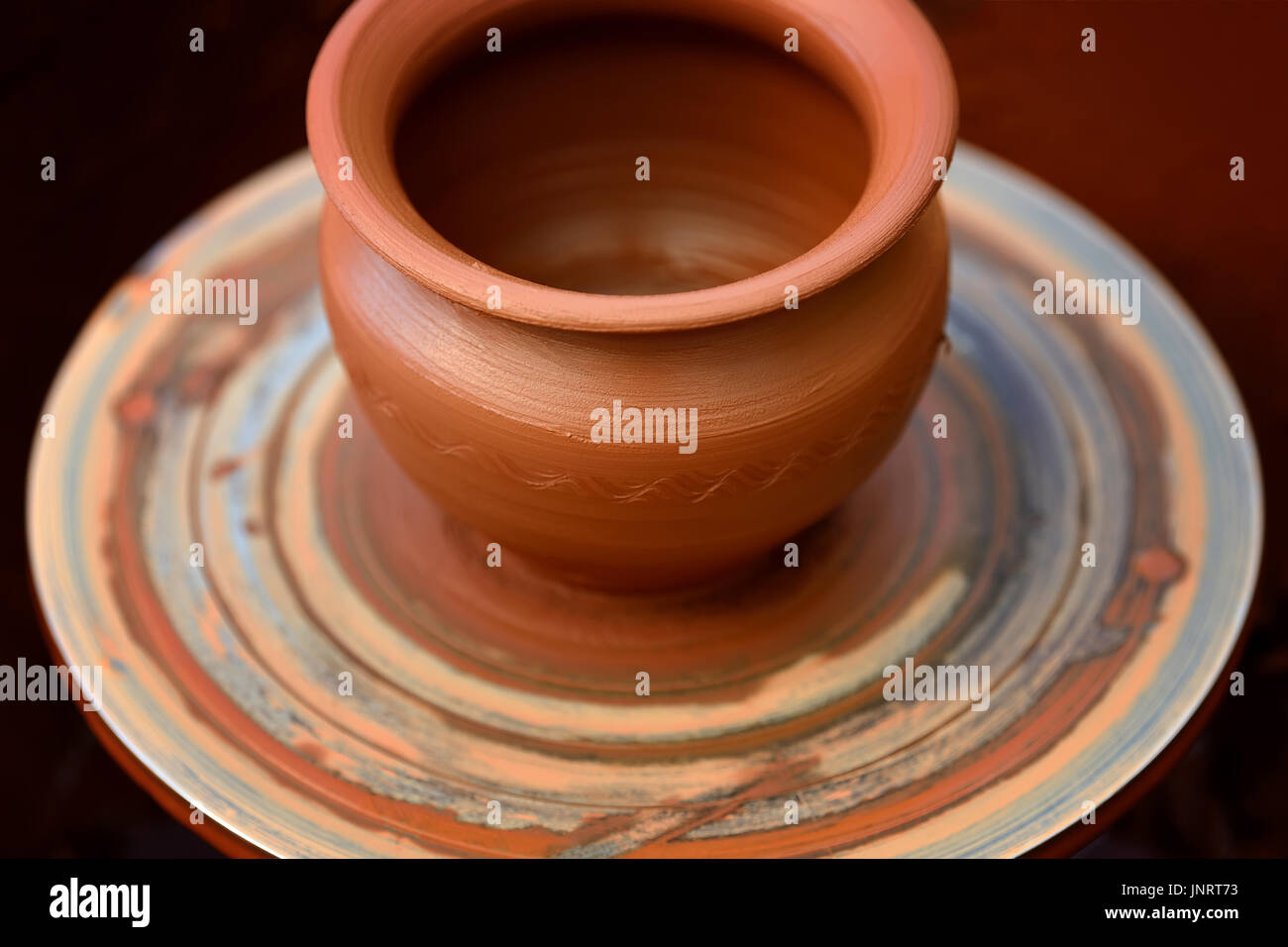 Hands of a potter. Potter making ceramic pot on the pottery wheel Stock ...