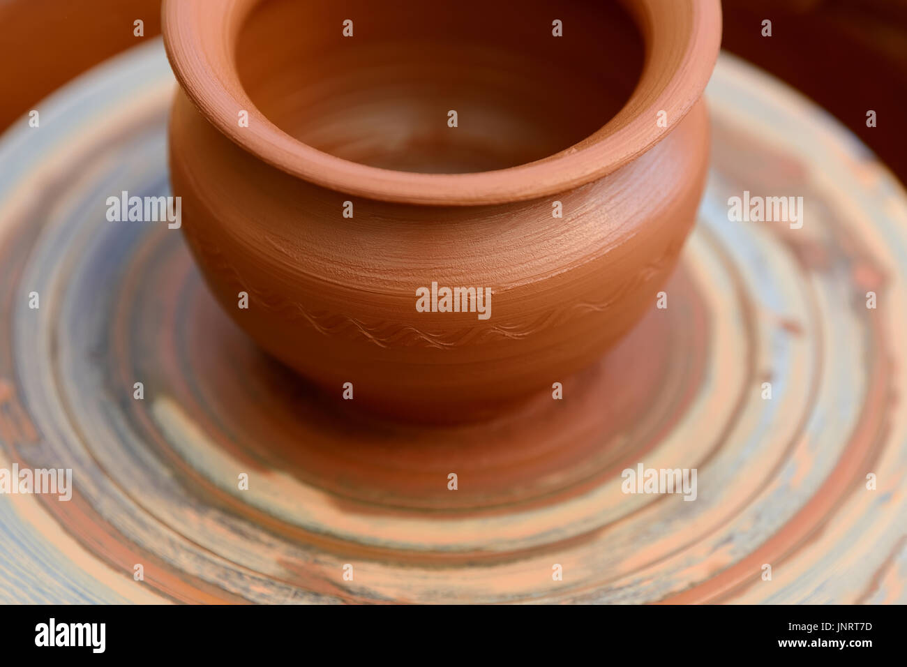 Hands of a potter. Potter making ceramic pot on the pottery wheel Stock ...