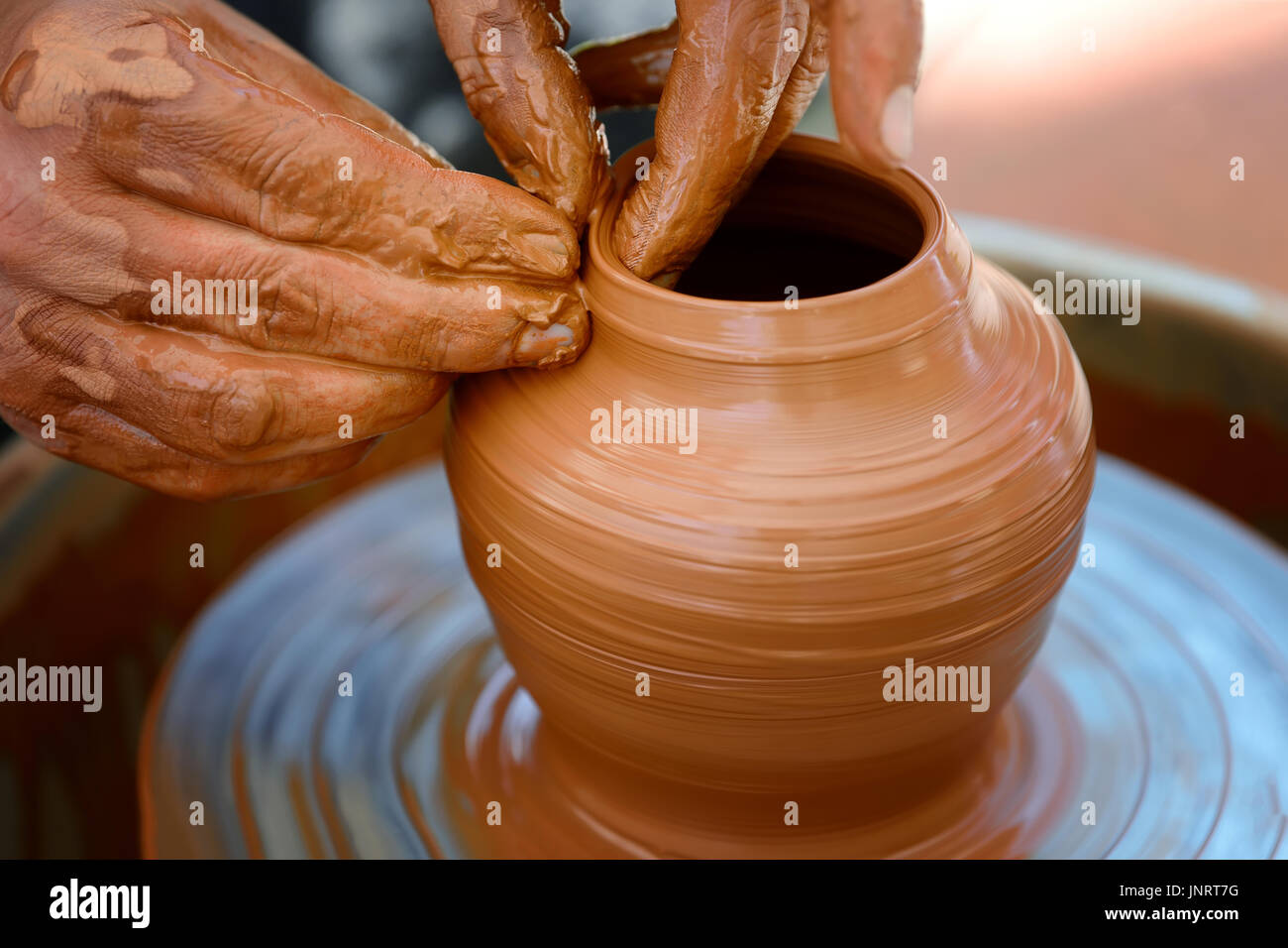 Hands of a potter. Potter making ceramic pot on the pottery wheel Stock ...