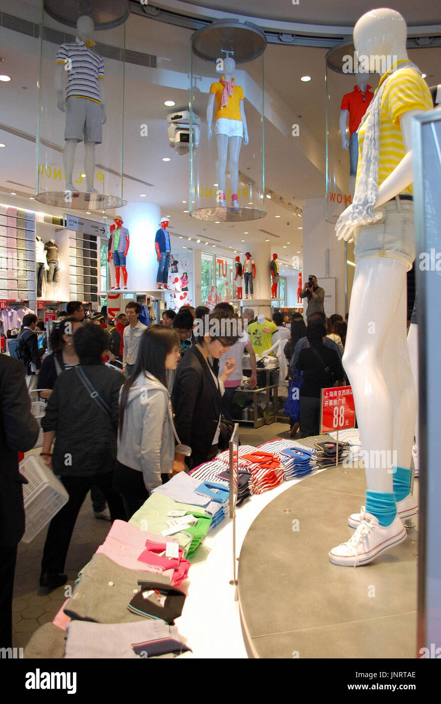 SHANGHAI, China - Shoppers flock to a flagship Uniqlo outlet in ...