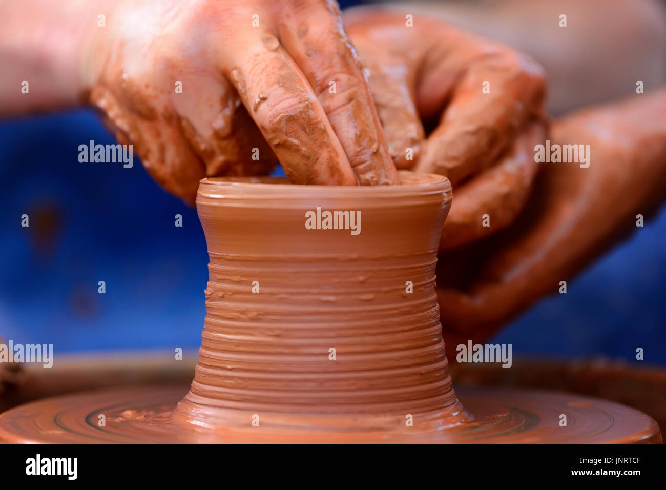 Hands of a potter. Potter making ceramic pot on the pottery wheel Stock ...