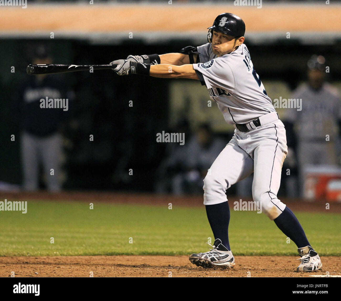 OAKLAND, United States - Ichiro Suzuki of the Seattle Mariners singles ...