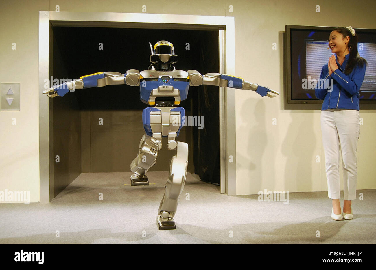 SHANGHAI, China - A two-legged humanoid robot is showcased balancing on ...