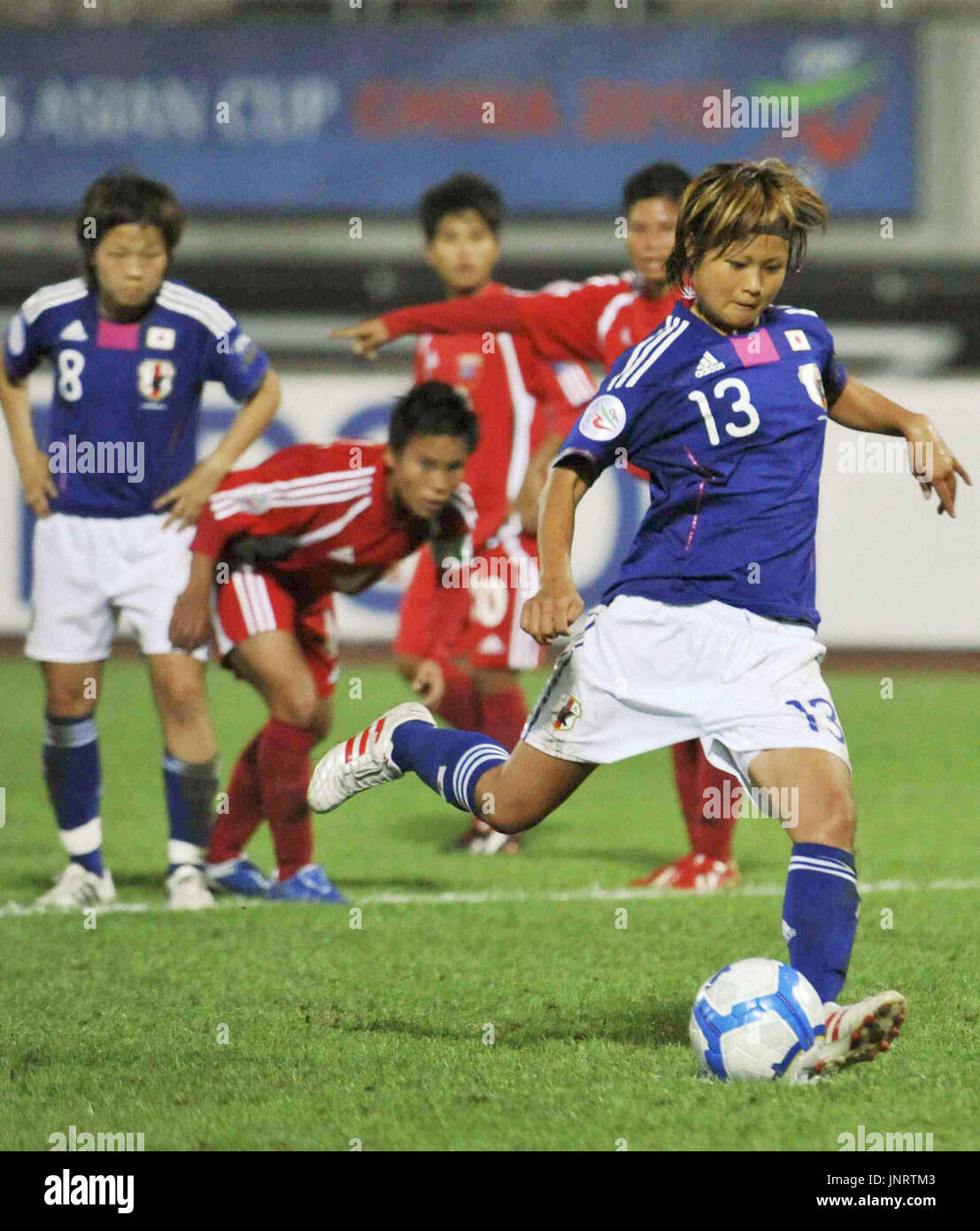 CHENGDU, China - Japan forward Mami Yamaguchi scores her side's third ...