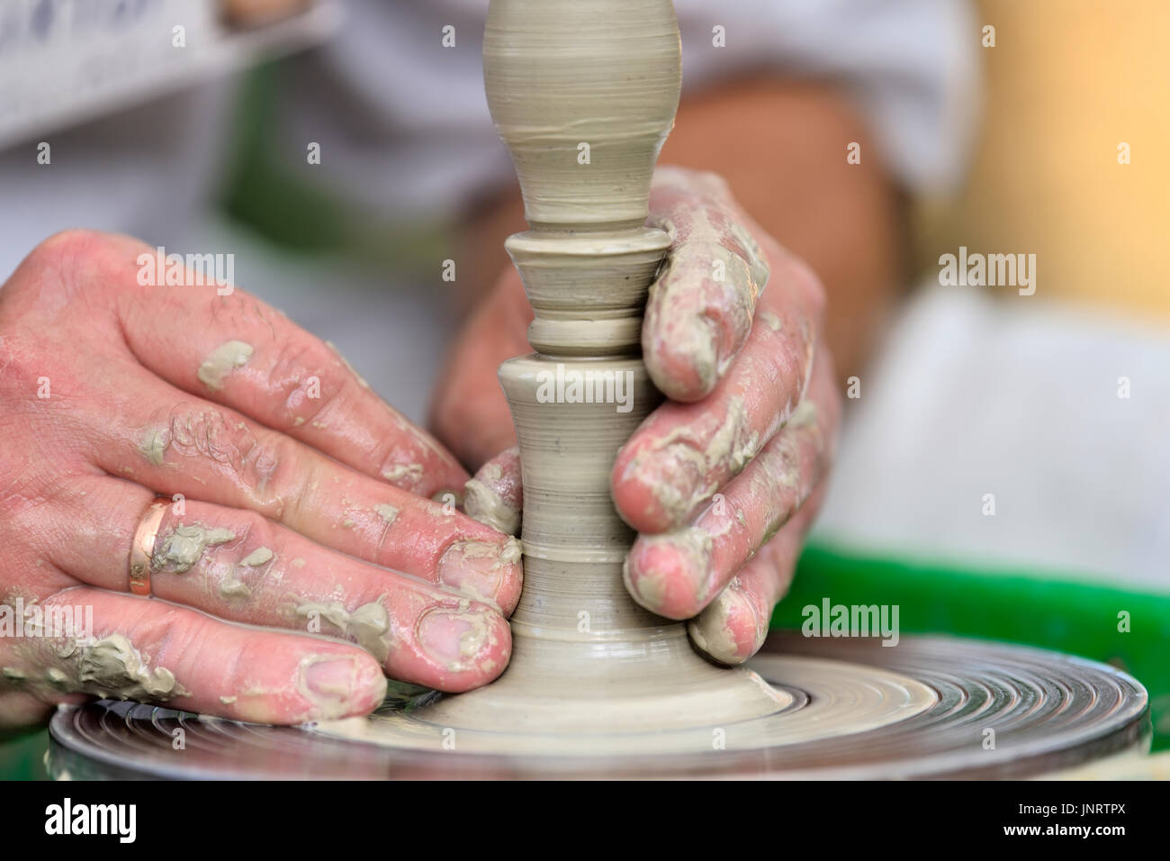 Hands of a potter. Potter making ceramic pot on the pottery wheel Stock ...