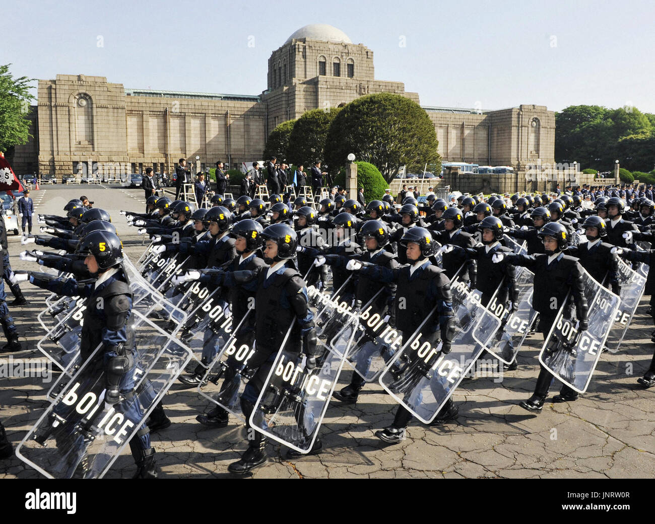 TOKYO, Japan - Riot police officers march at an annual review of the ...