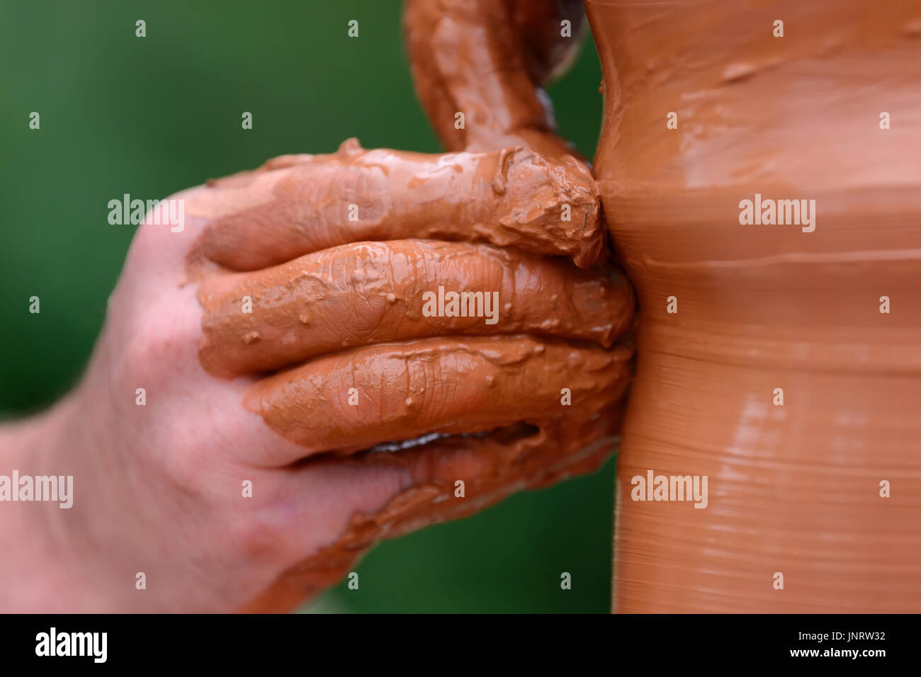 Hands of a potter. Potter making ceramic pot on the pottery wheel Stock ...