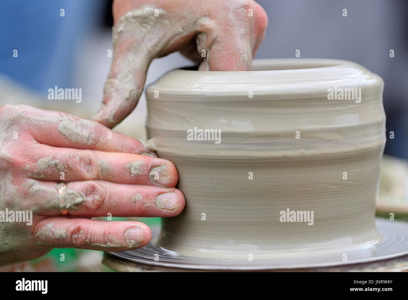 Hands of a potter. Potter making ceramic pot on the pottery wheel Stock ...