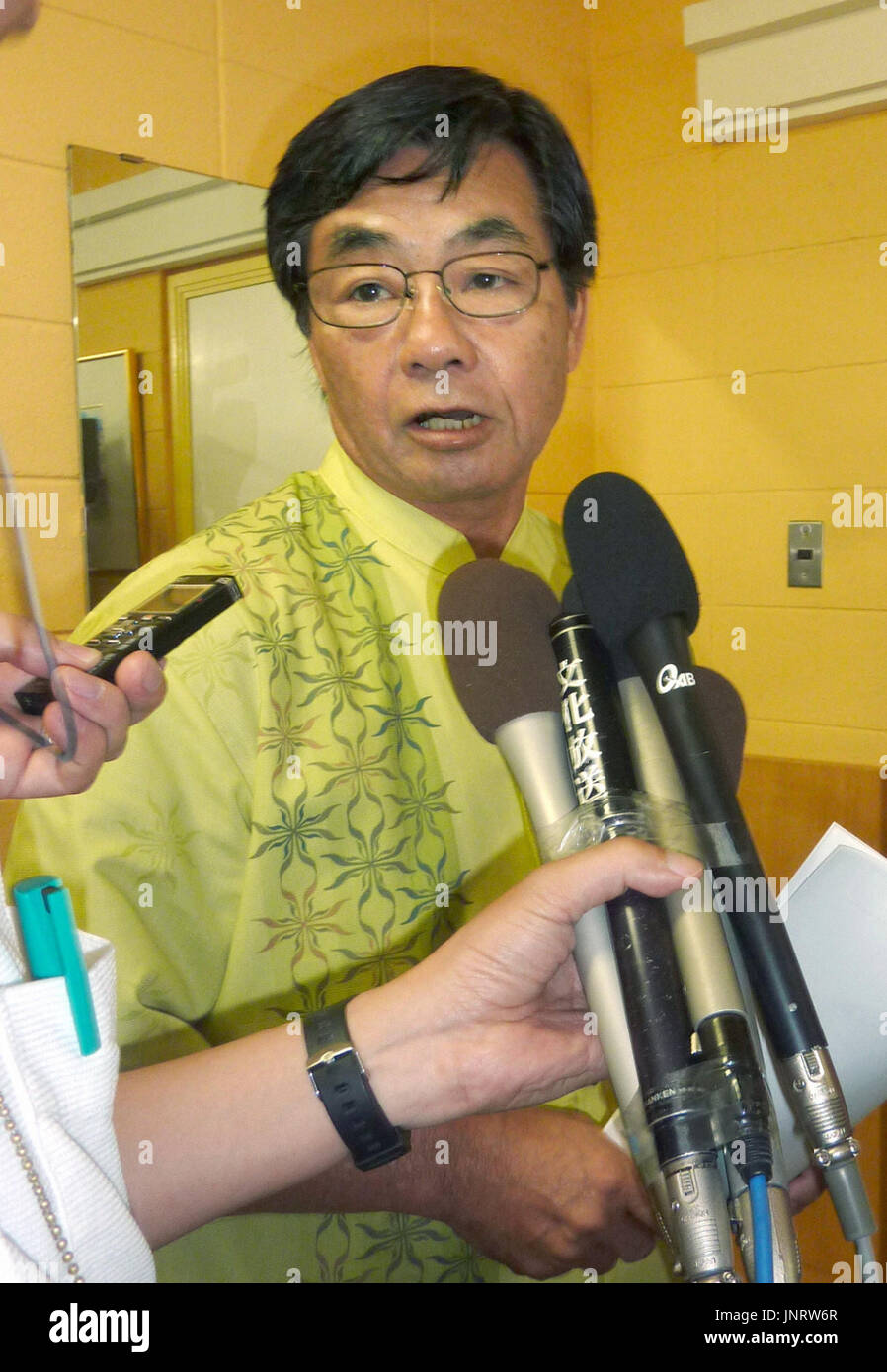 NAHA, Japan - Nago Mayor Susumu Inamine speaks to reporters at the city ...