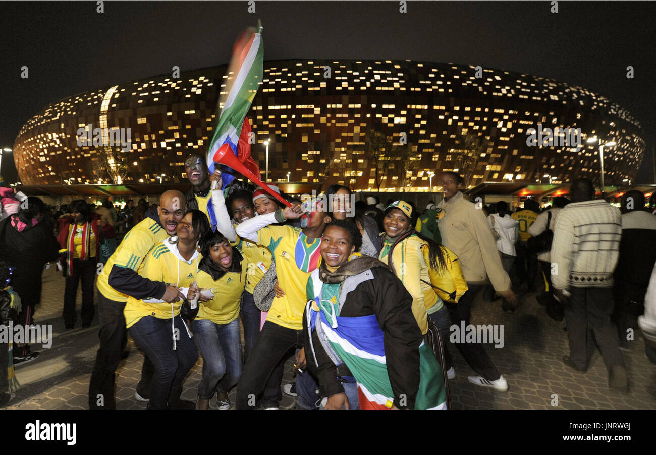 JOHANNESBURG, South Africa - Soccer fans cheer near Soccer City in ...