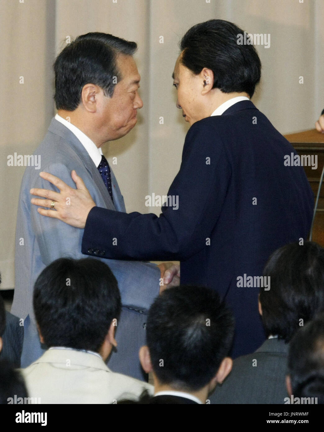 TOKYO, Japan - Prime Minister Yukio Hatoyama (R) talks with Ichiro Ozawa, secretary general of ...