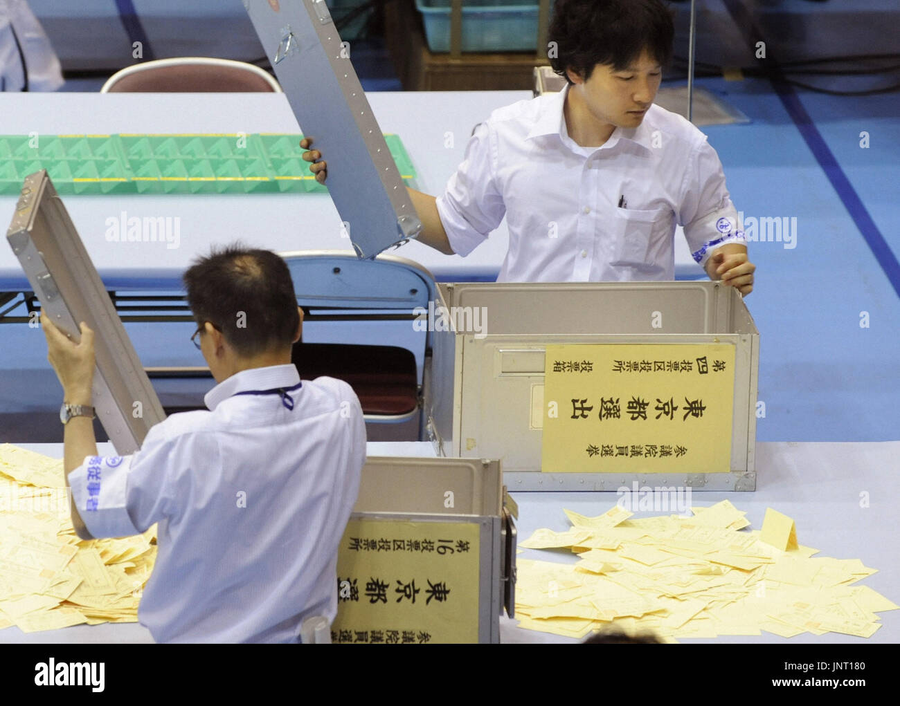 TOKYO, Japan - Election committee workers start counting ballots for ...