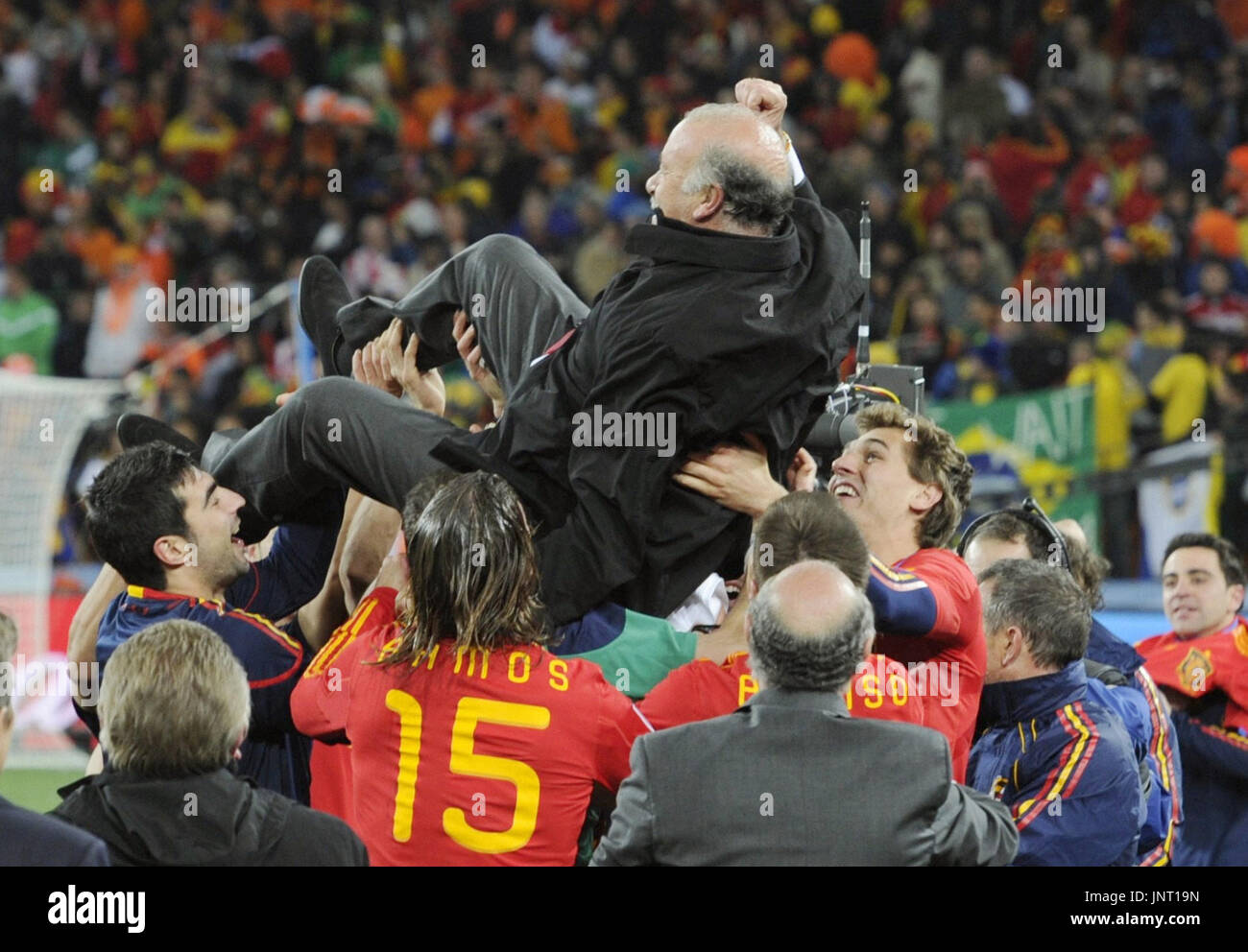 JOHANNESBURG, South Africa - Spain players toss their coach Vicente Del ...
