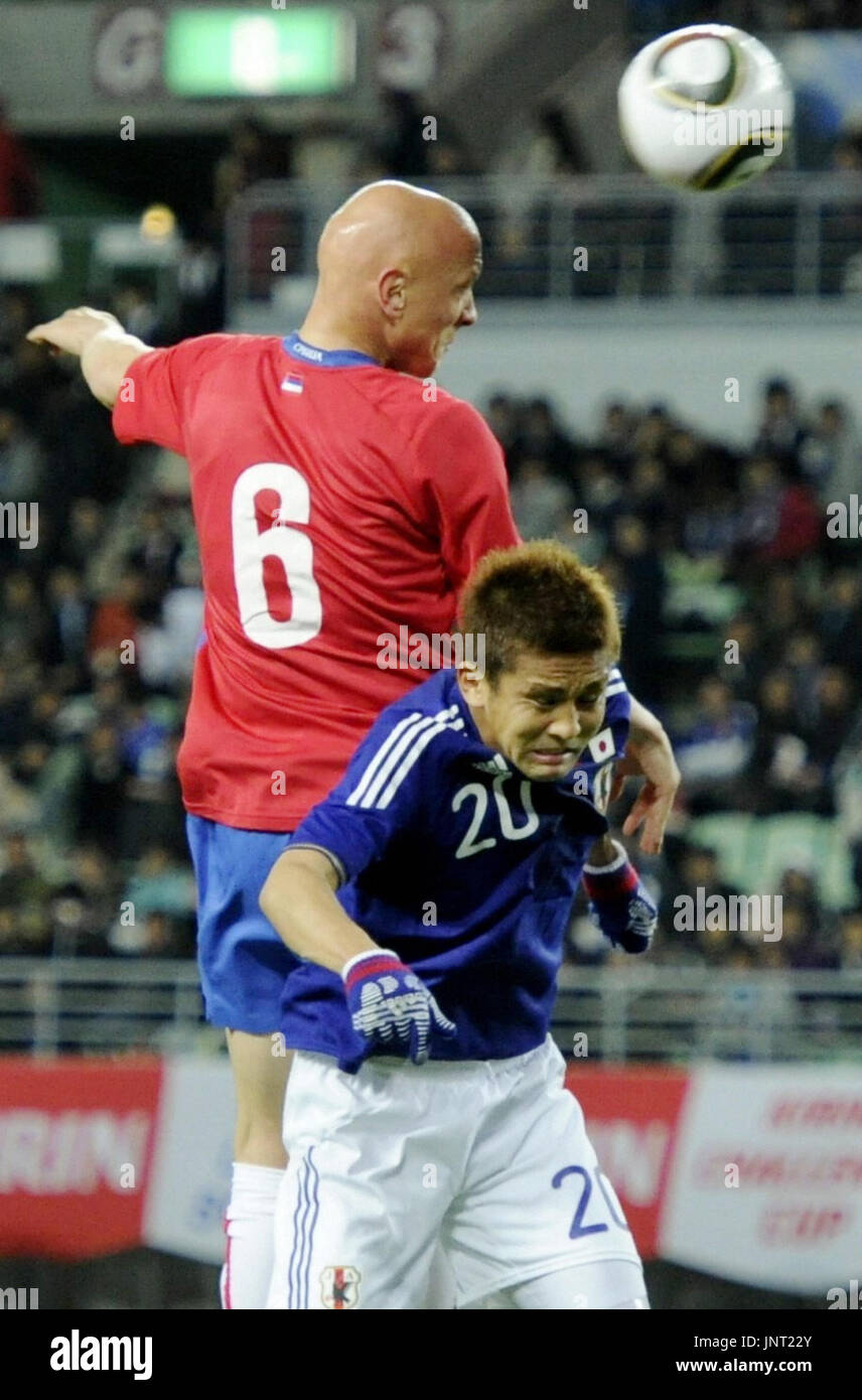 OSAKA, Japan - Japan midfielder Junichi Inamoto and Serbia defender ...