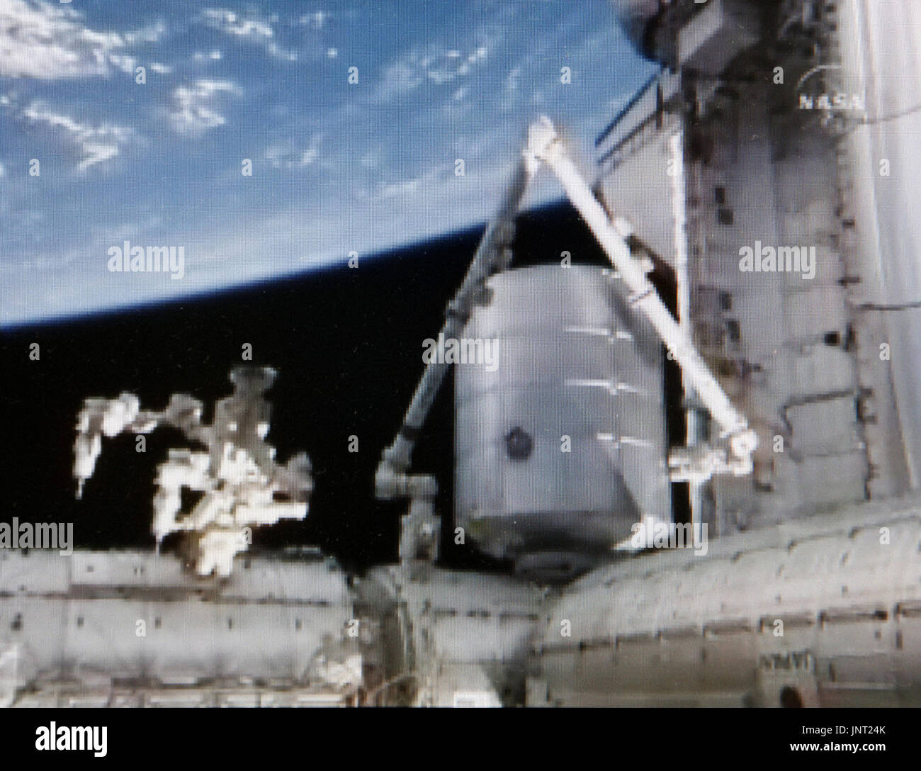 TOKYO, Japan - This photo taken from NASA TV shows a robotic arm of the ...