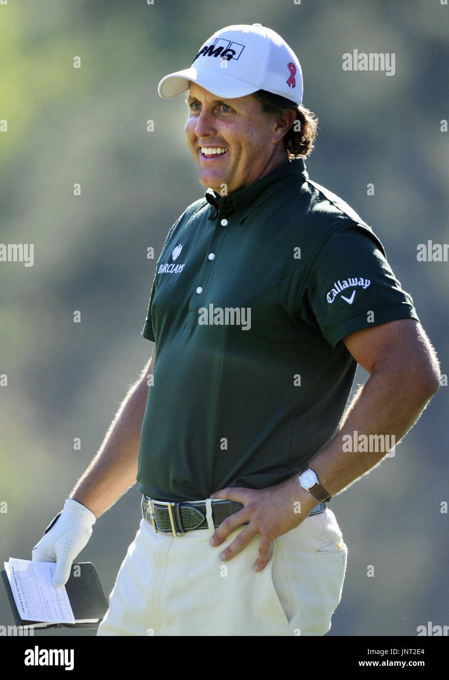 AUGUSTA, United States - Phil Mickelson smiles after making an eagle on ...