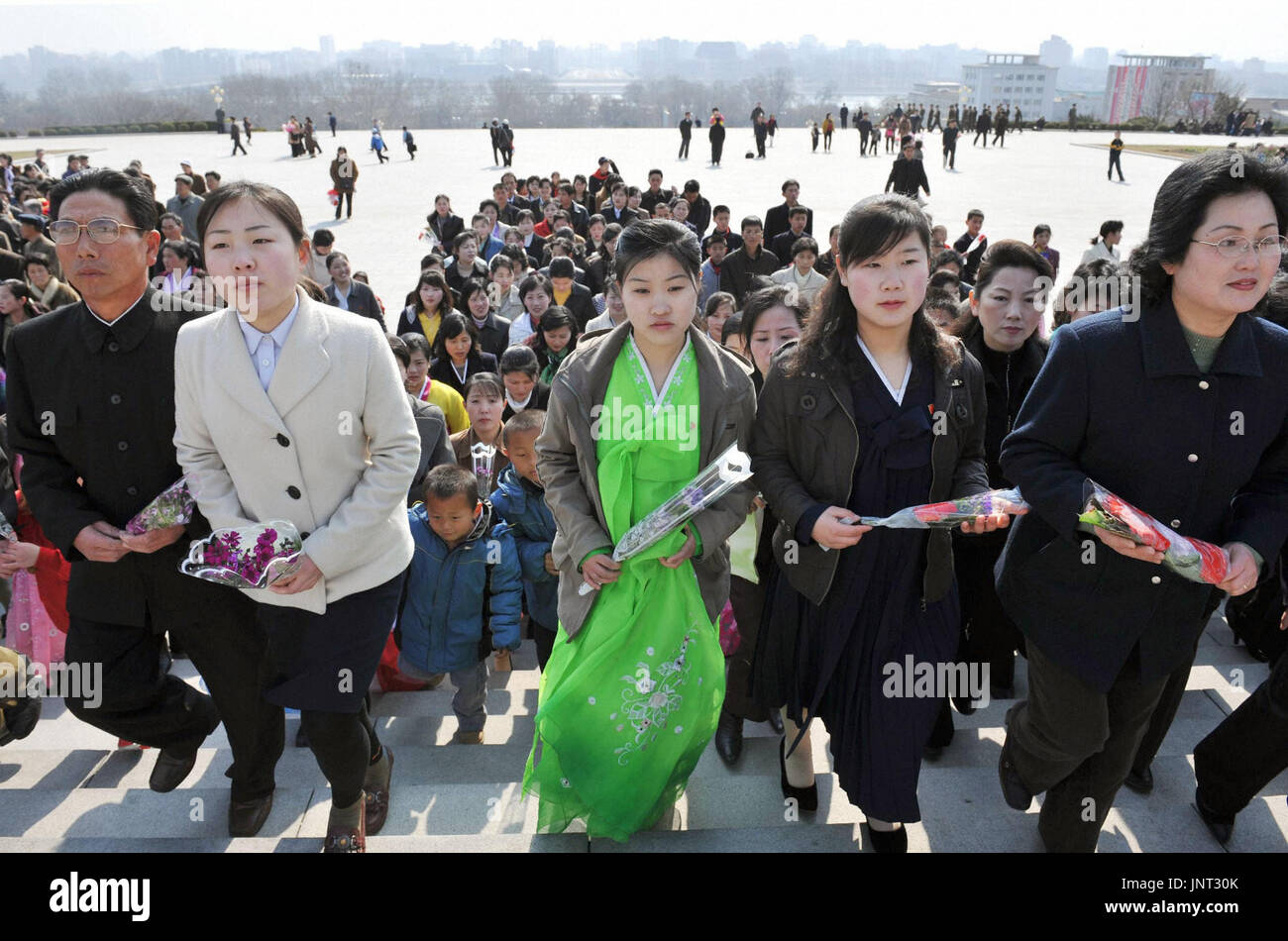 PYONGYANG, North Korea - North Korean citizens dressed in suits and ...