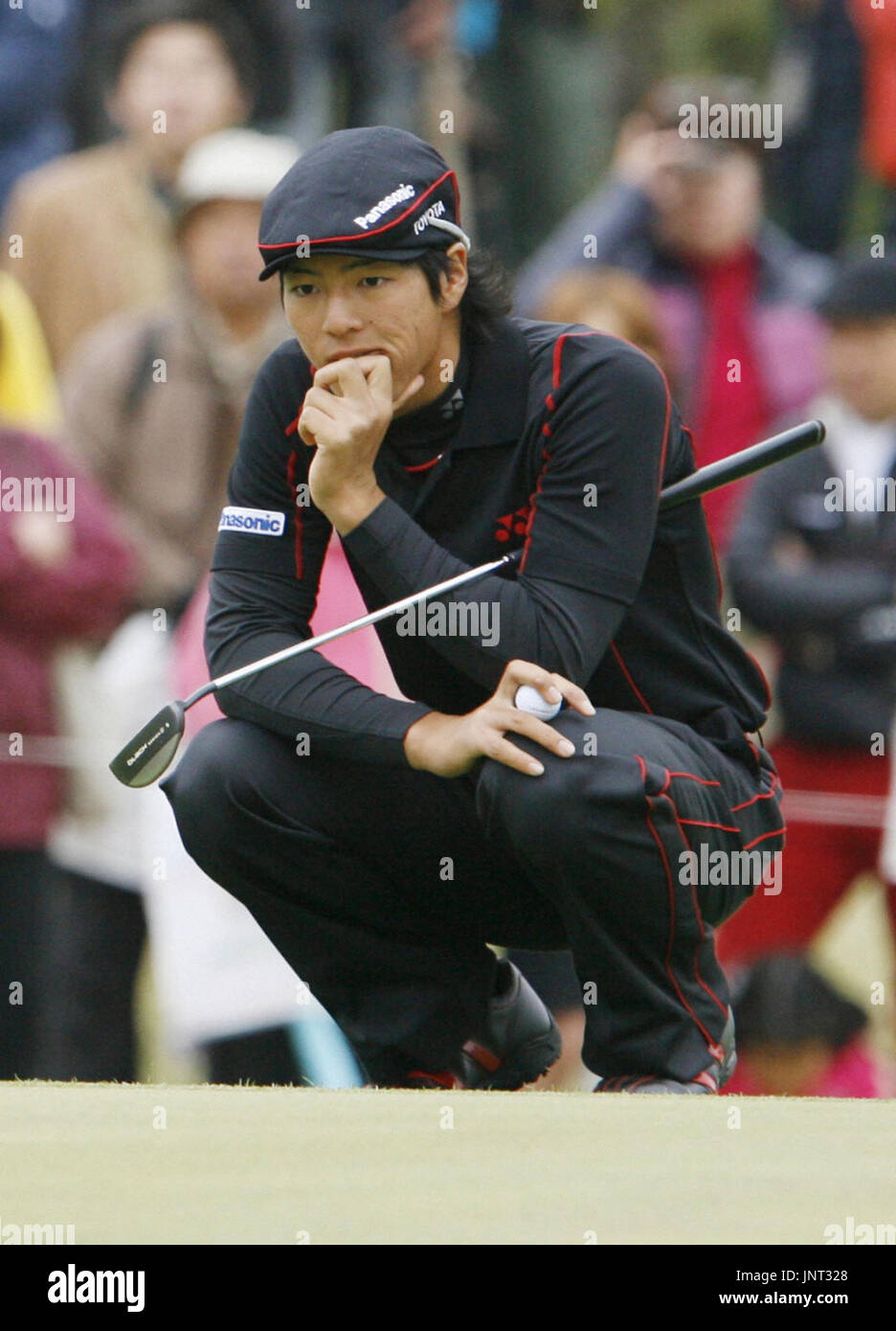 KUWANA, Japan - Japanese teenage golfer Ryo Ishikawa ponders his next shot on the seventh green ...