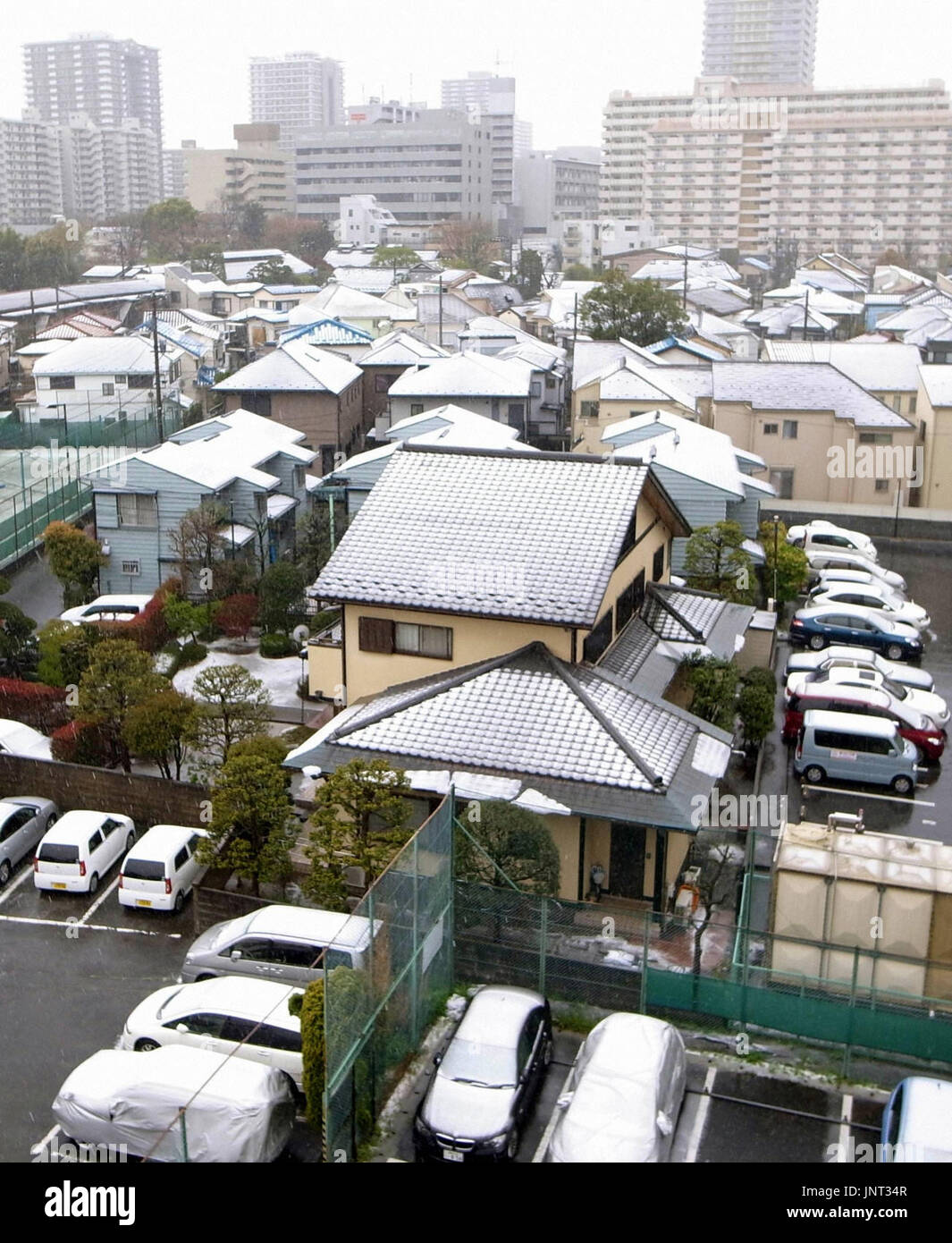TOKYO, Japan - Rooftops of houses in Tokyo's Nerima Ward are lightly ...
