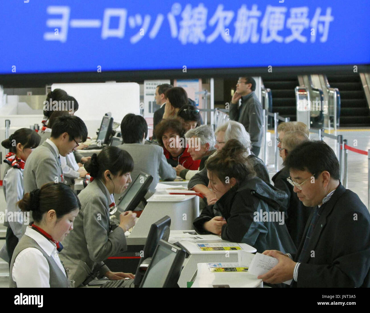 TOKYO, Japan - Passengers inundate check-in counters of airline ...