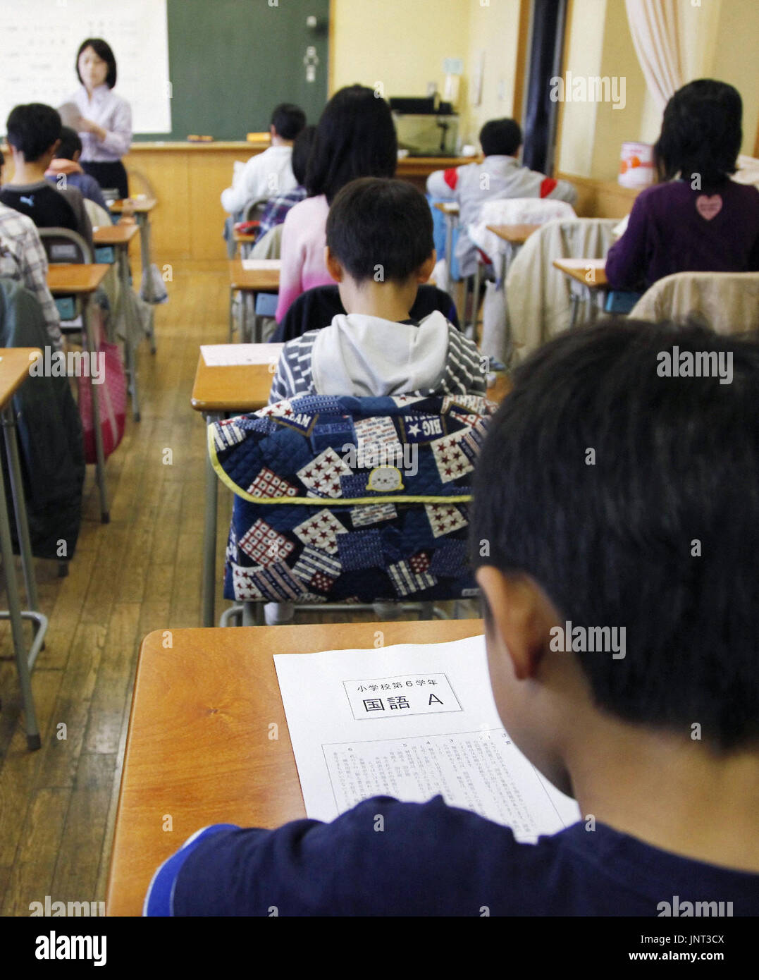 TOKYO, Japan - School children sit to take annual national achievement ...