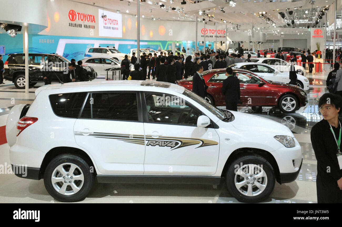 BEIJING, China - Visitors view Toyota Motor Corp. vehicles displayed at ...
