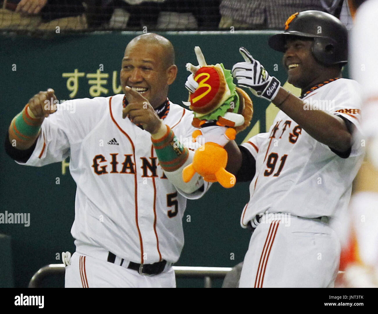 TOKYO, Japan - Yomiuri Giants pitcher Wirfin Obispo (R) strikes a pose ...