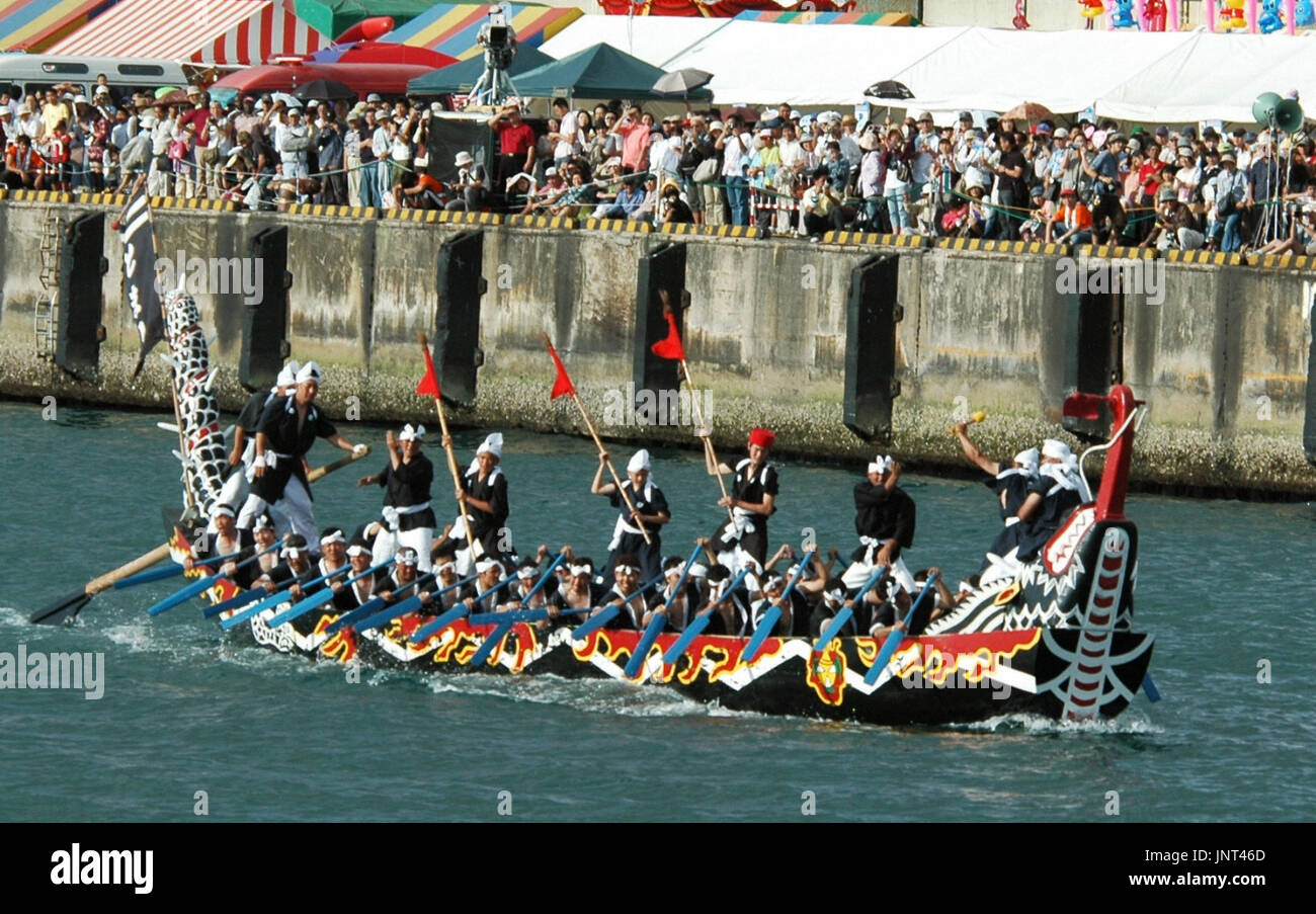 NAHA, Japan - A dragon boat races in the ''hari'' competition in Naha ...