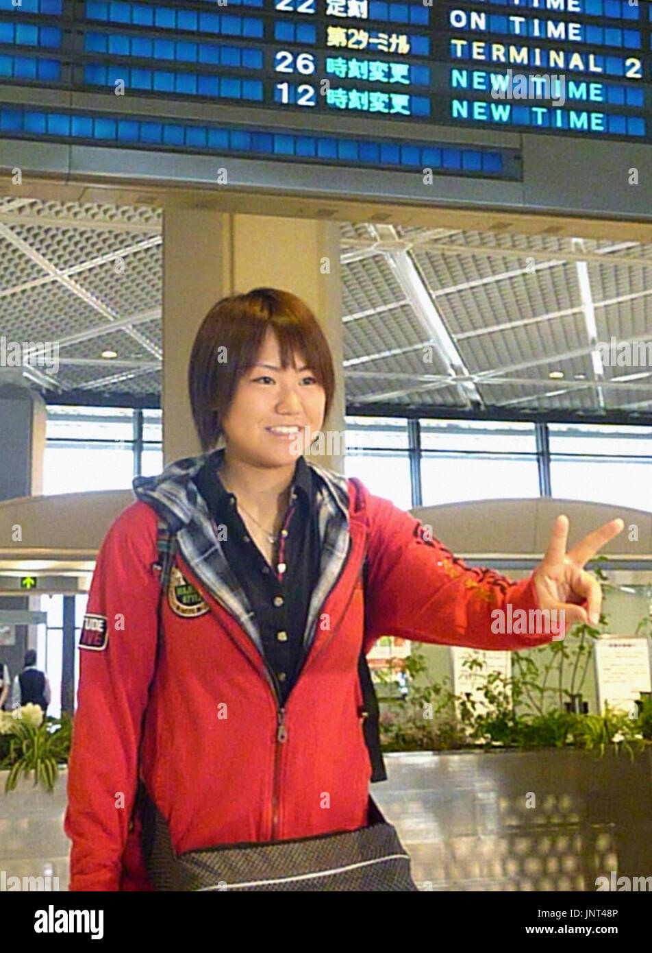 NARITA, Japan - Japanese female knuckleballer Eri Yoshida poses for a photo at Narita airport ...