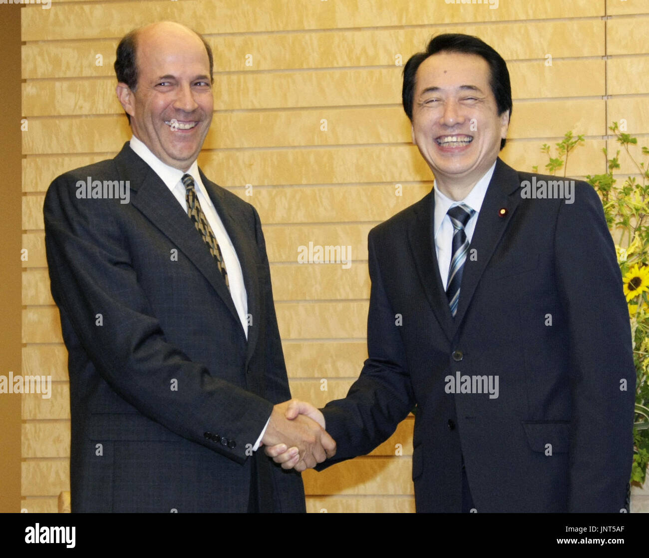 TOKYO, Japan - Prime Minister Naoto Kan (R) and U.S. Ambassador to ...