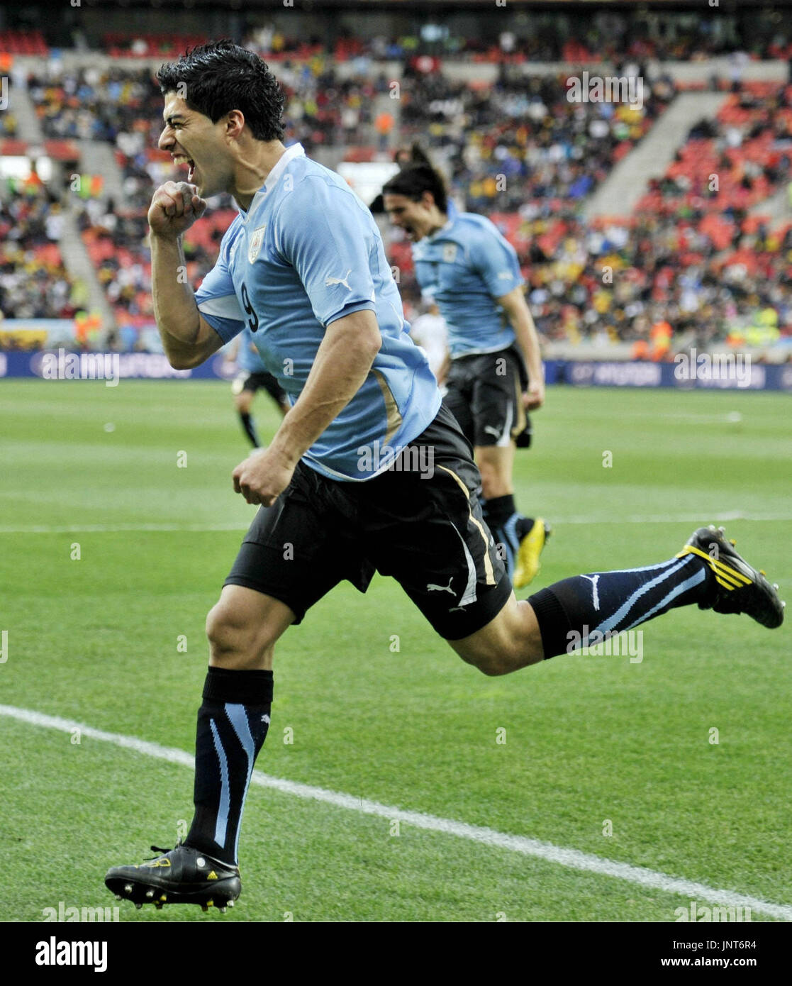 PORT ELIZABETH, South Africa - Uruguay striker Luis Suarez celebrates ...