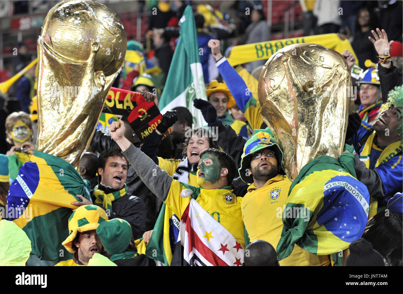 JOHANNESBURG, South Africa - Brazil supporters cheer, holding replicas ...