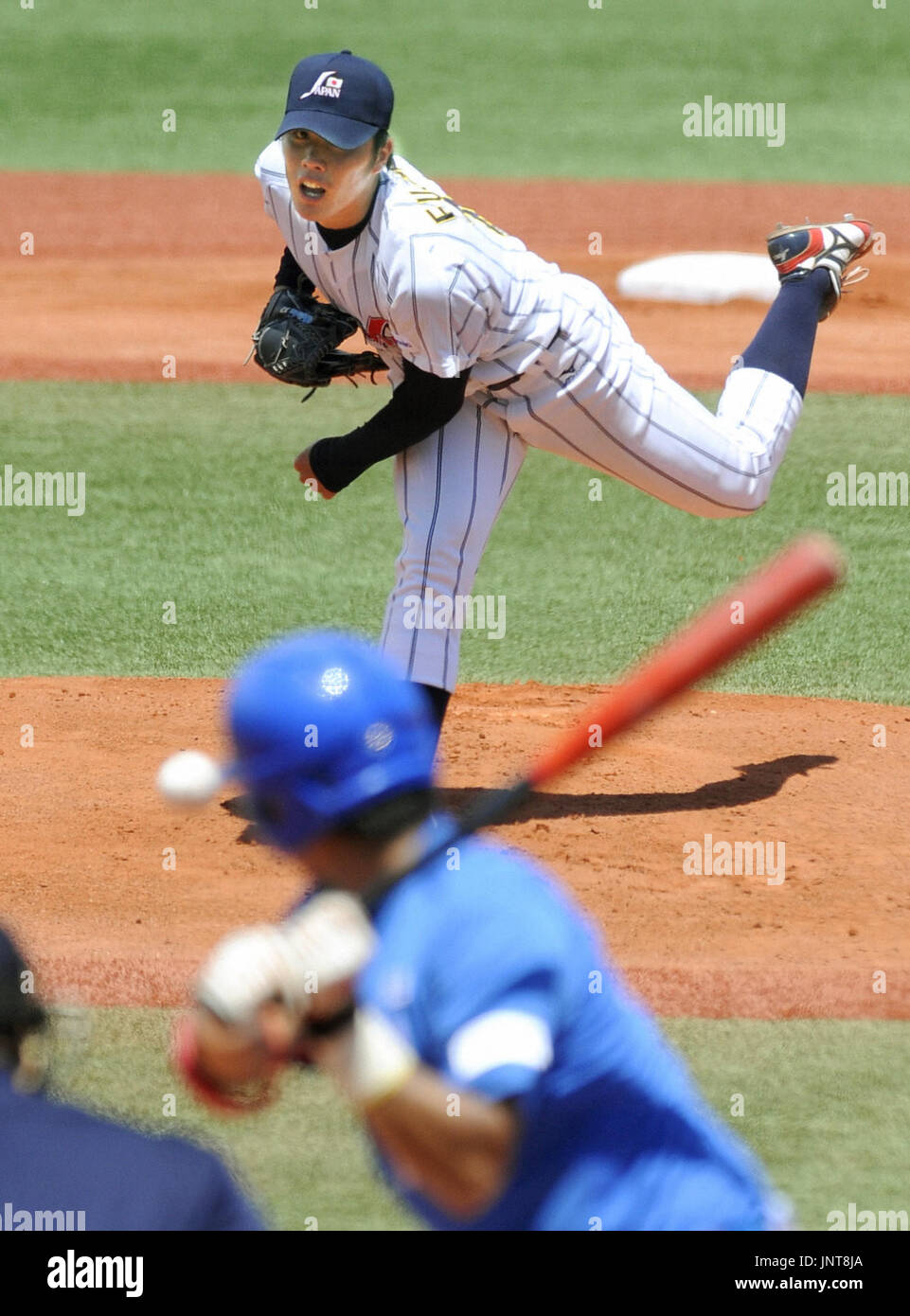 TOKYO, Japan - Japan's starting pitcher Takahiro Fujioka pitches ...