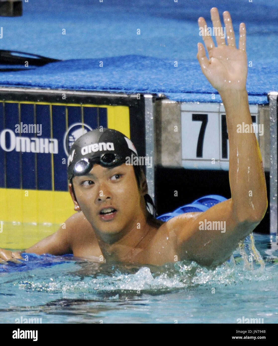 IRVINE, United States - Japan's Junya Koga waves after winning the 50 ...